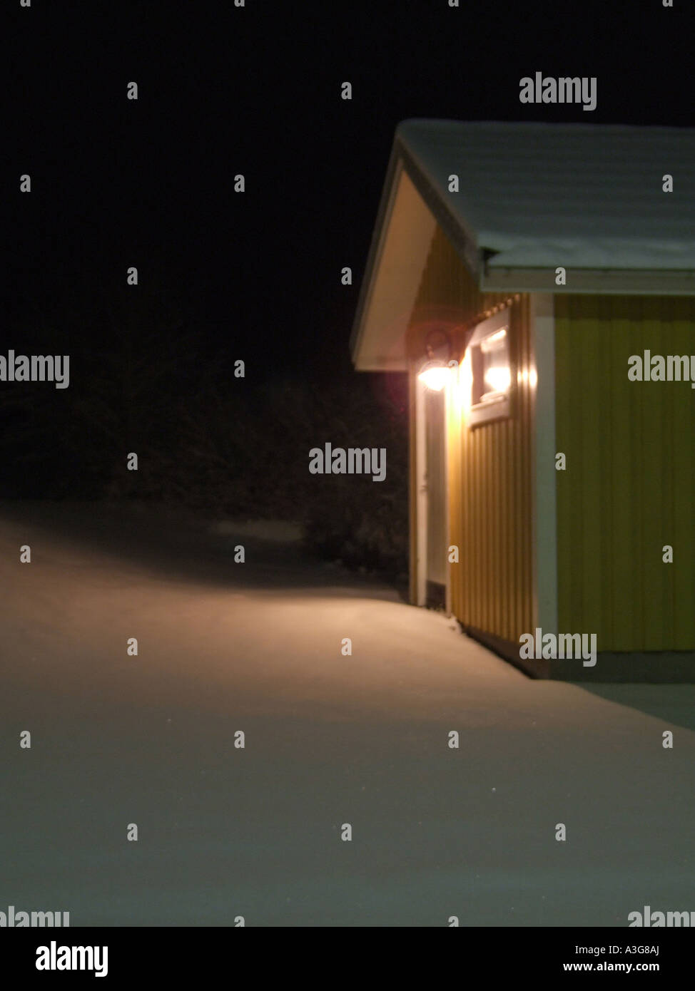 single garage by snow covered street at night in sweden Stock Photo - Alamy