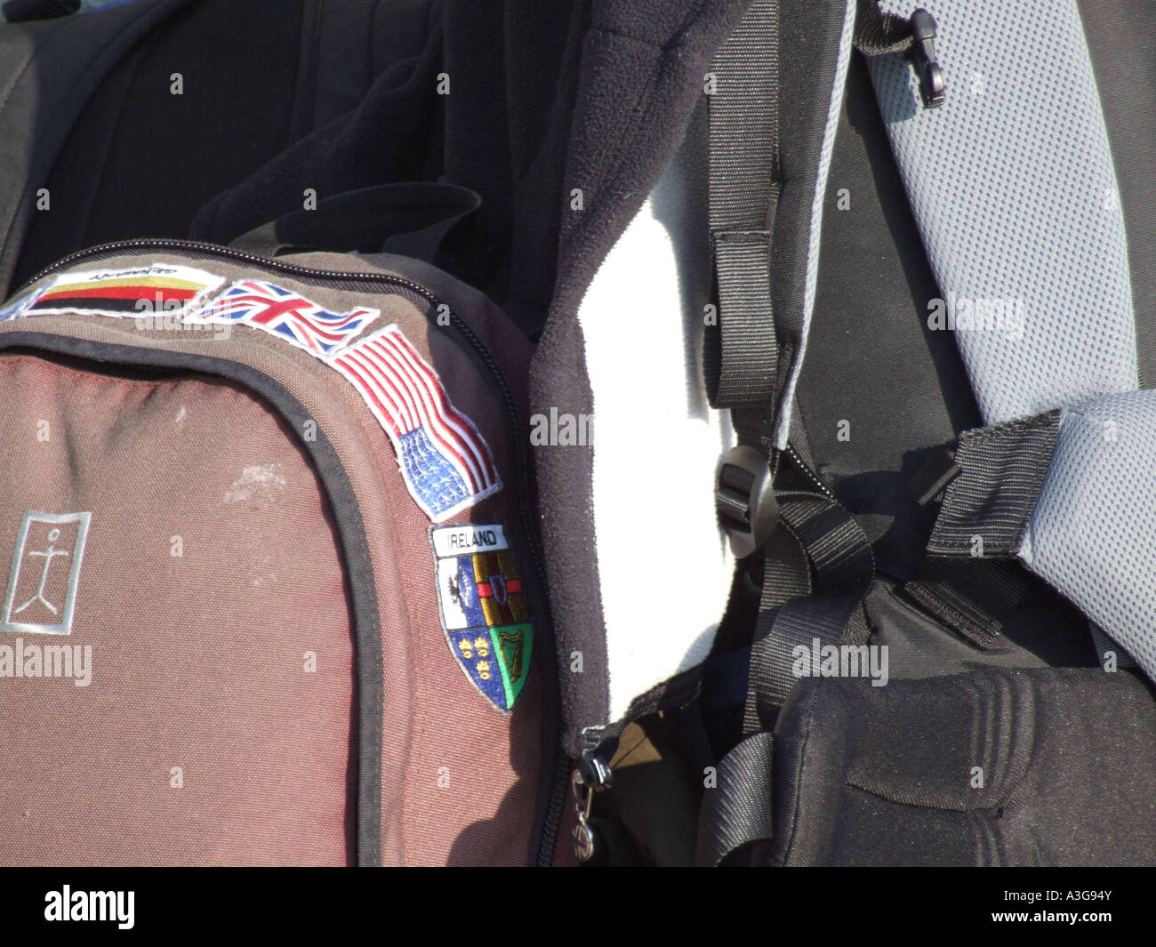 various country nation badges on backpack Stock Photo - Alamy