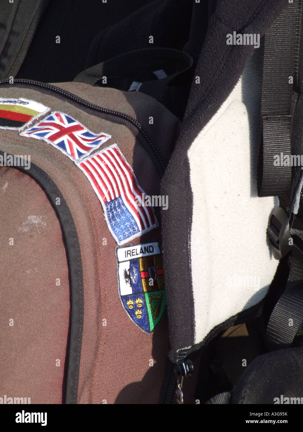 various country nation badges on backpack Stock Photo - Alamy