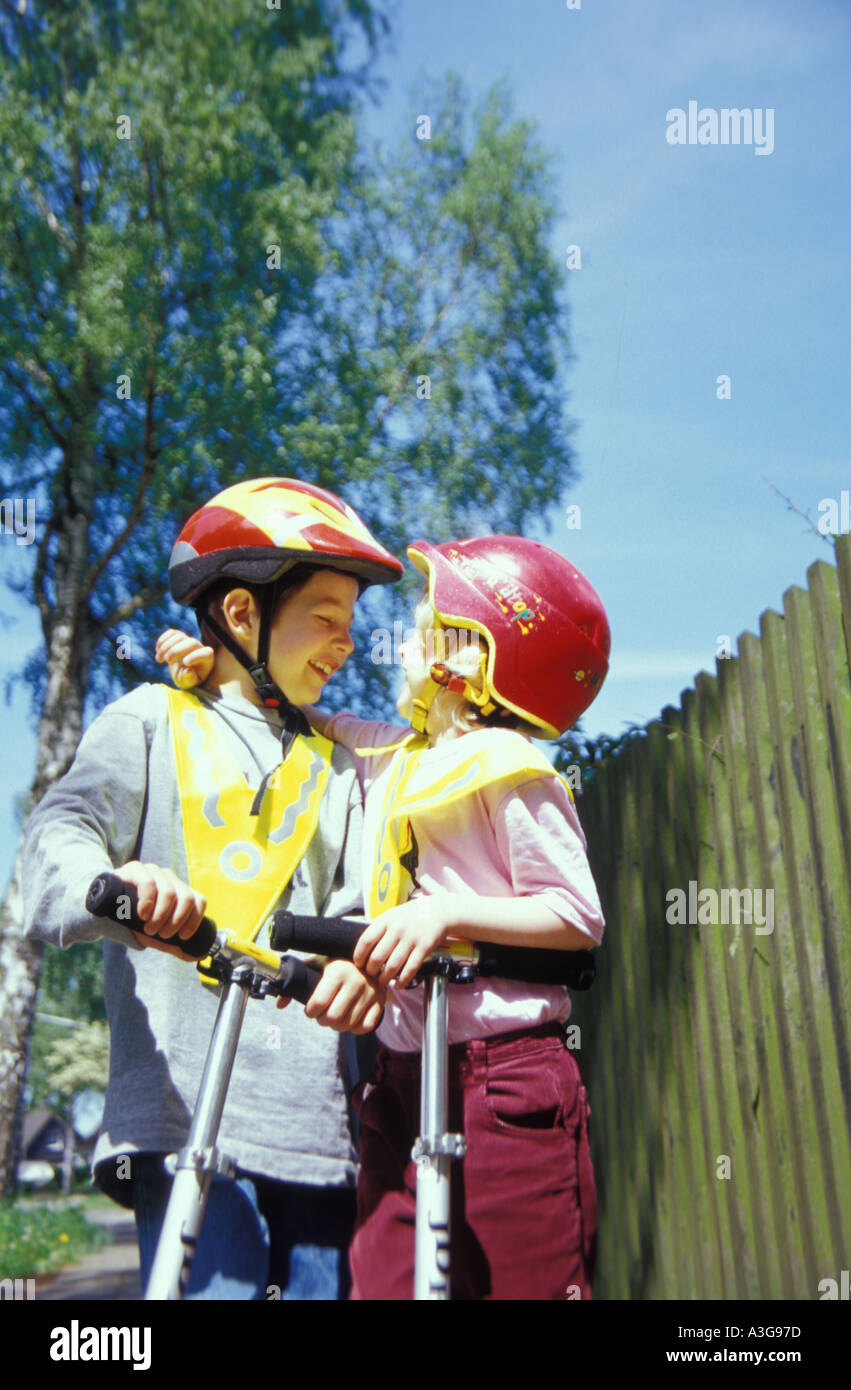 Children wearing crash helmet, smiling Stock Photo - Alamy