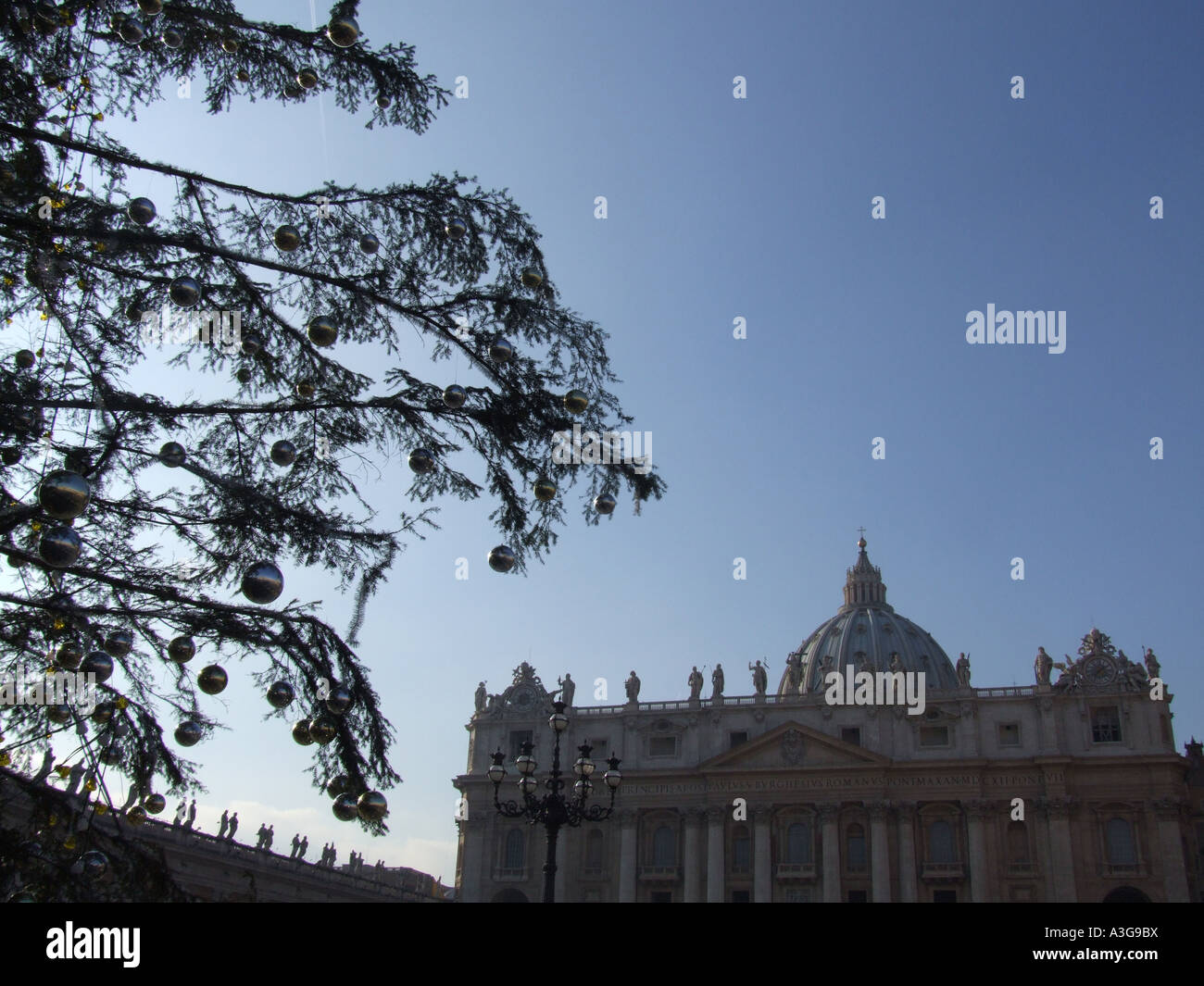 vatican dome in rome with xmas tree Stock Photo - Alamy