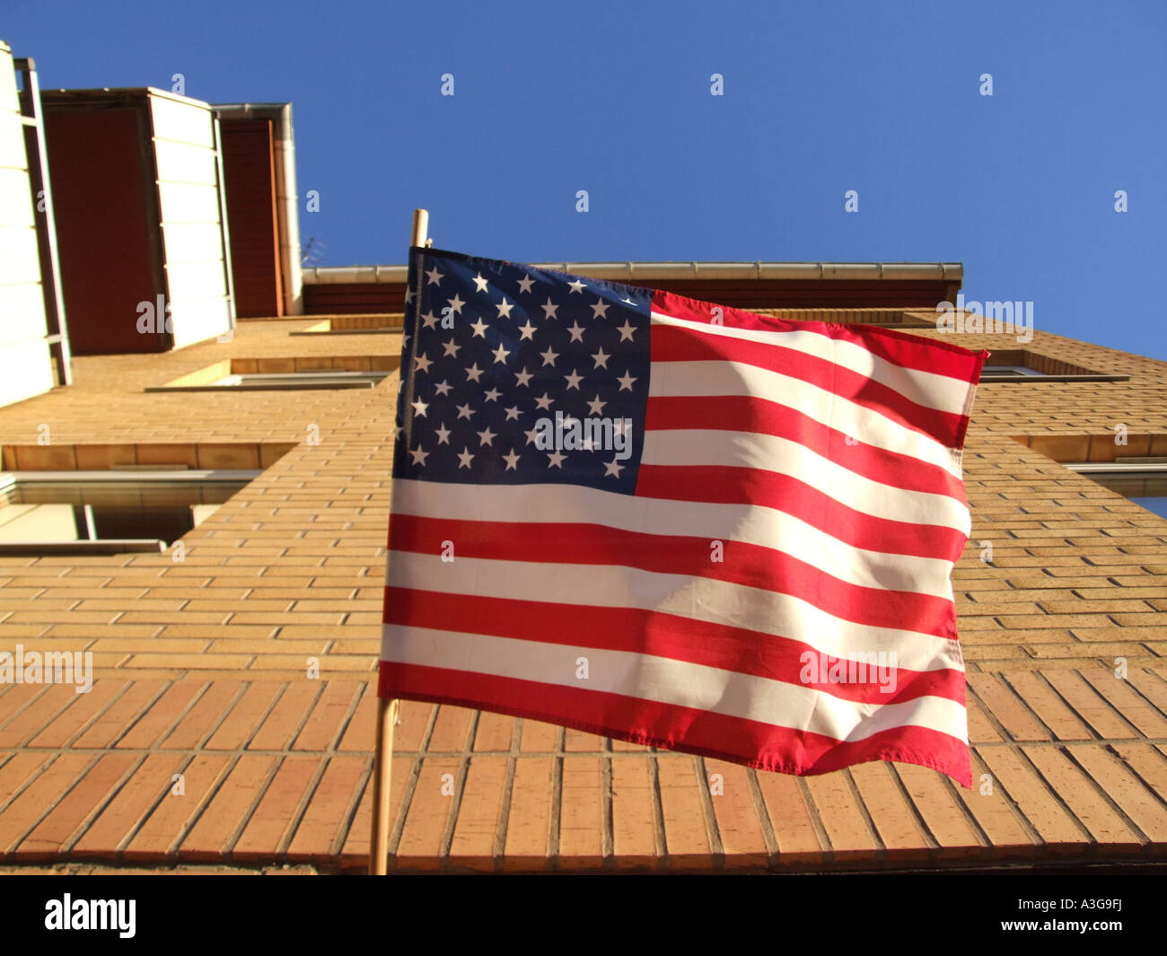american flag by modern building Stock Photo - Alamy
