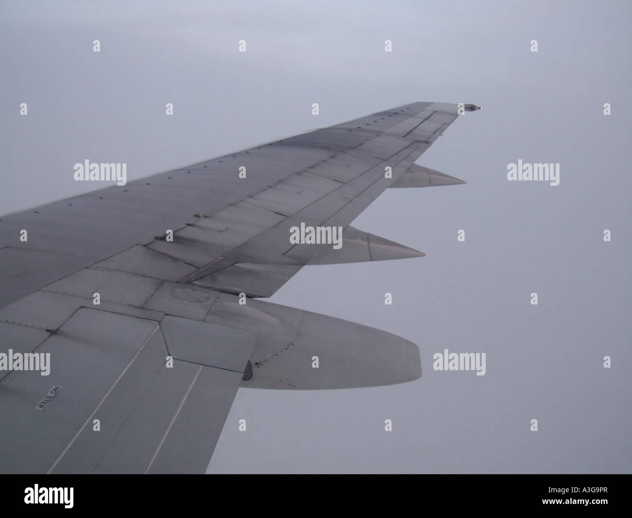 view of one old dirty plane wing from passenger window Stock Photo - Alamy