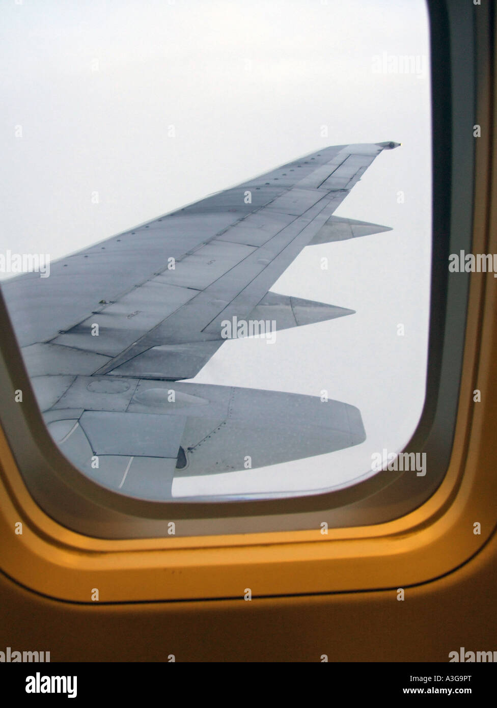 view of one old dirty plane wing from passenger window Stock Photo - Alamy