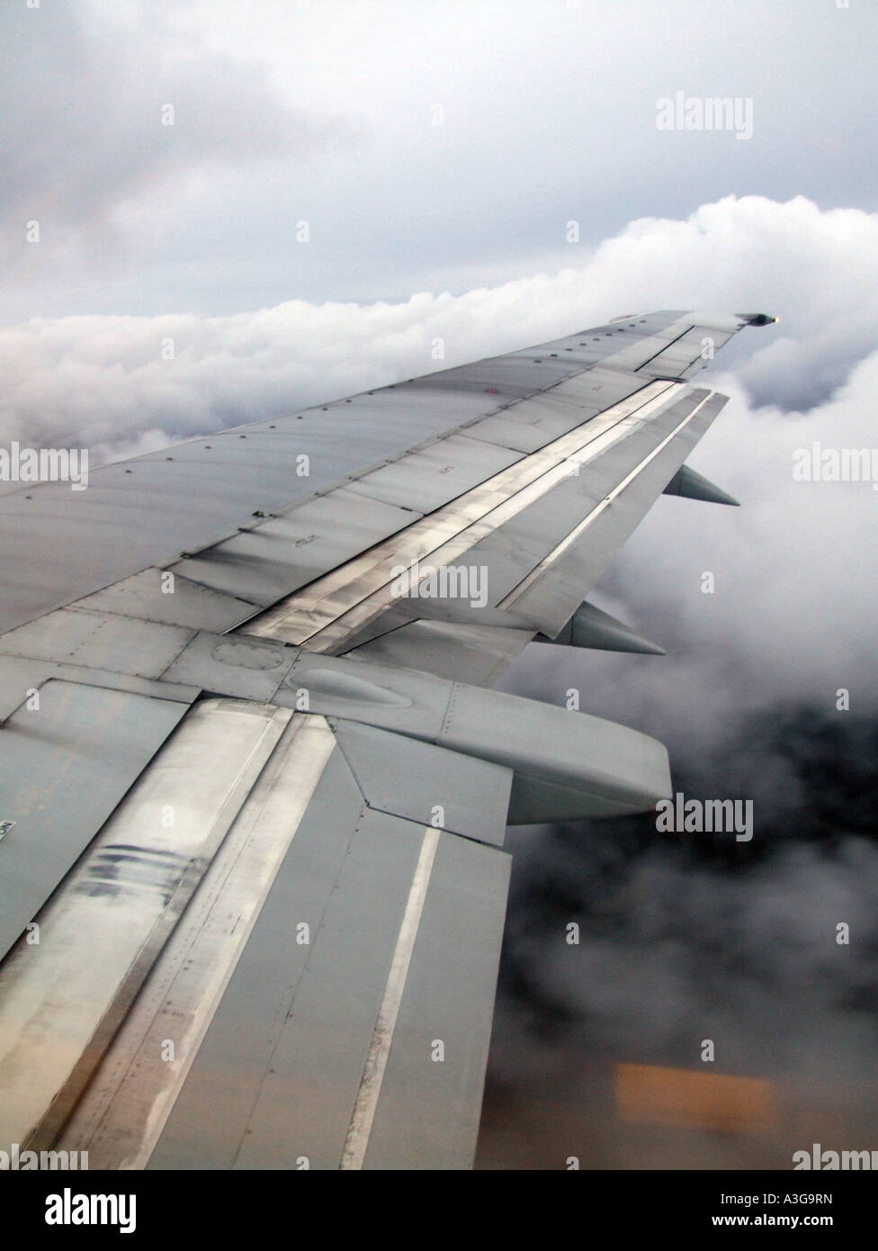 view of one old dirty plane wing from passenger window Stock Photo - Alamy