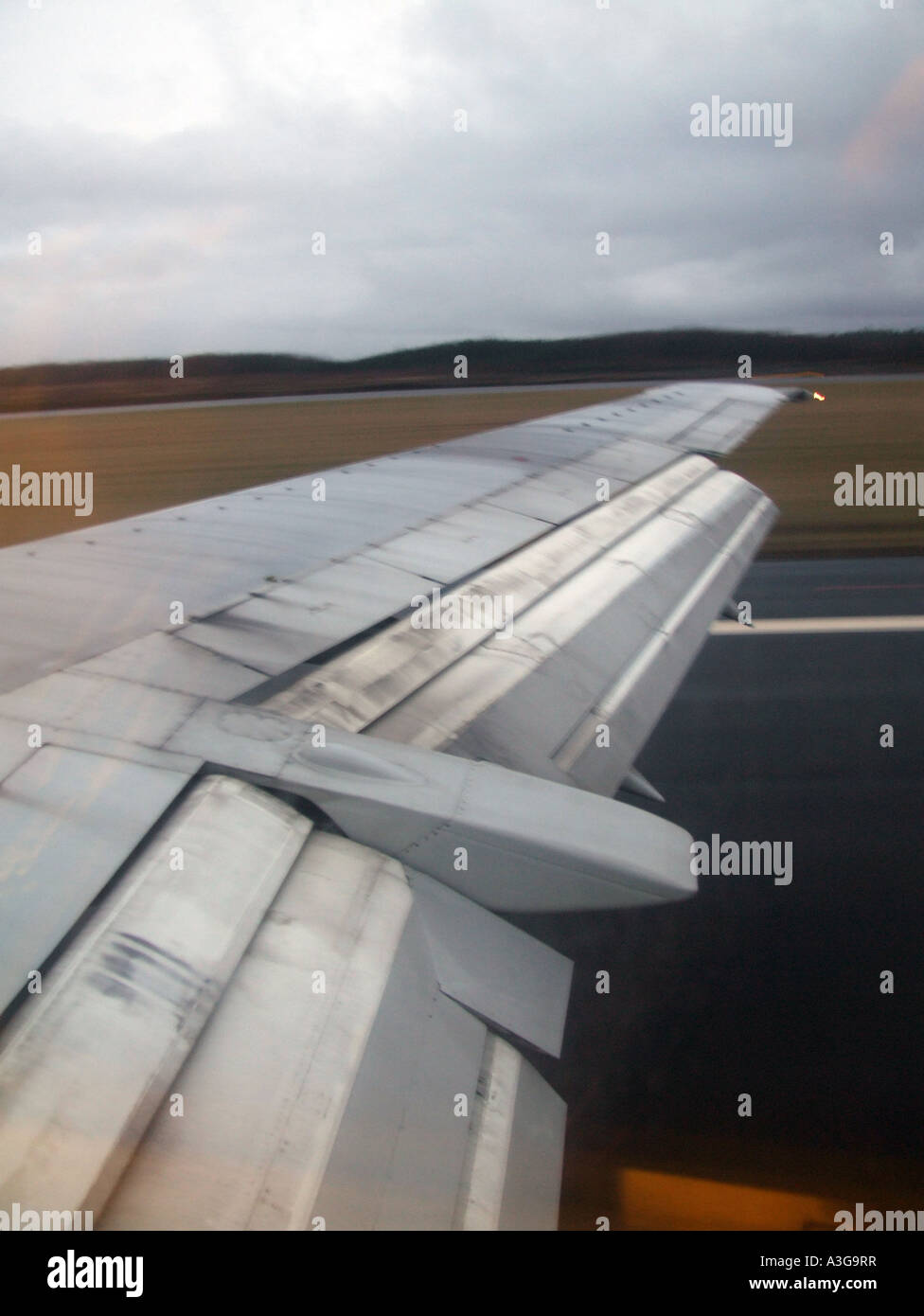 view of one old dirty plane wing from passenger window Stock Photo - Alamy