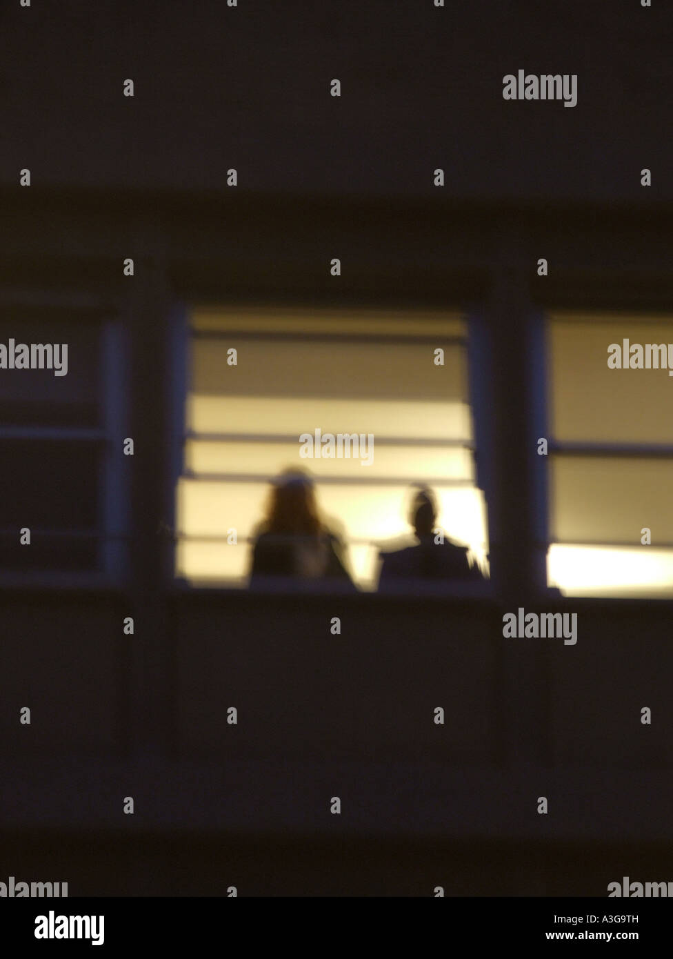 people at office window at night Stock Photo - Alamy