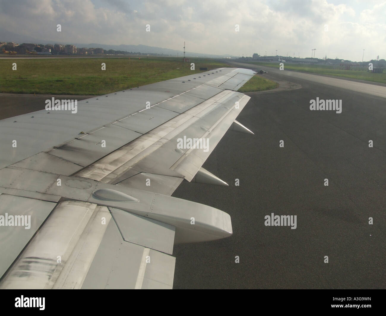 view of one old dirty plane wing from passenger window Stock Photo - Alamy