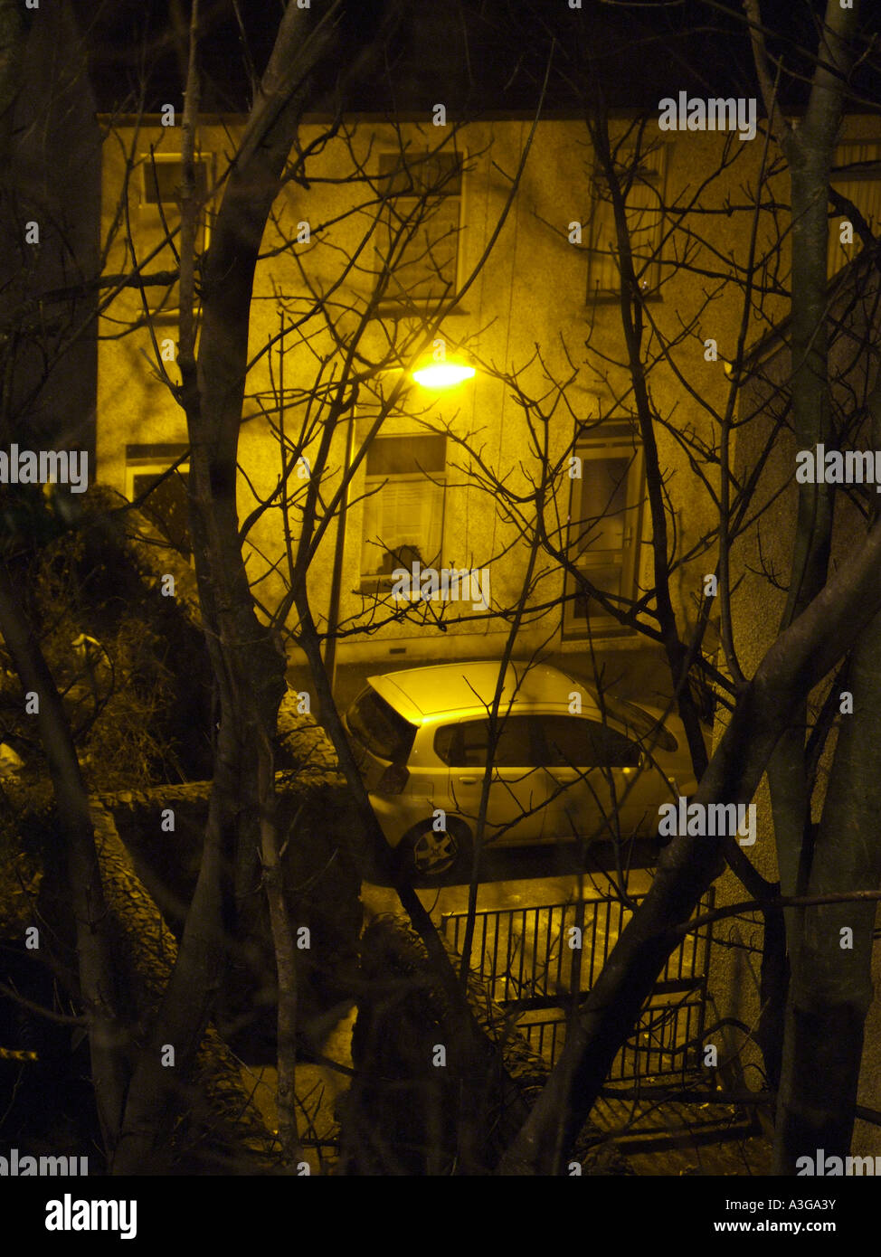 car parked outside home at night Stock Photo - Alamy