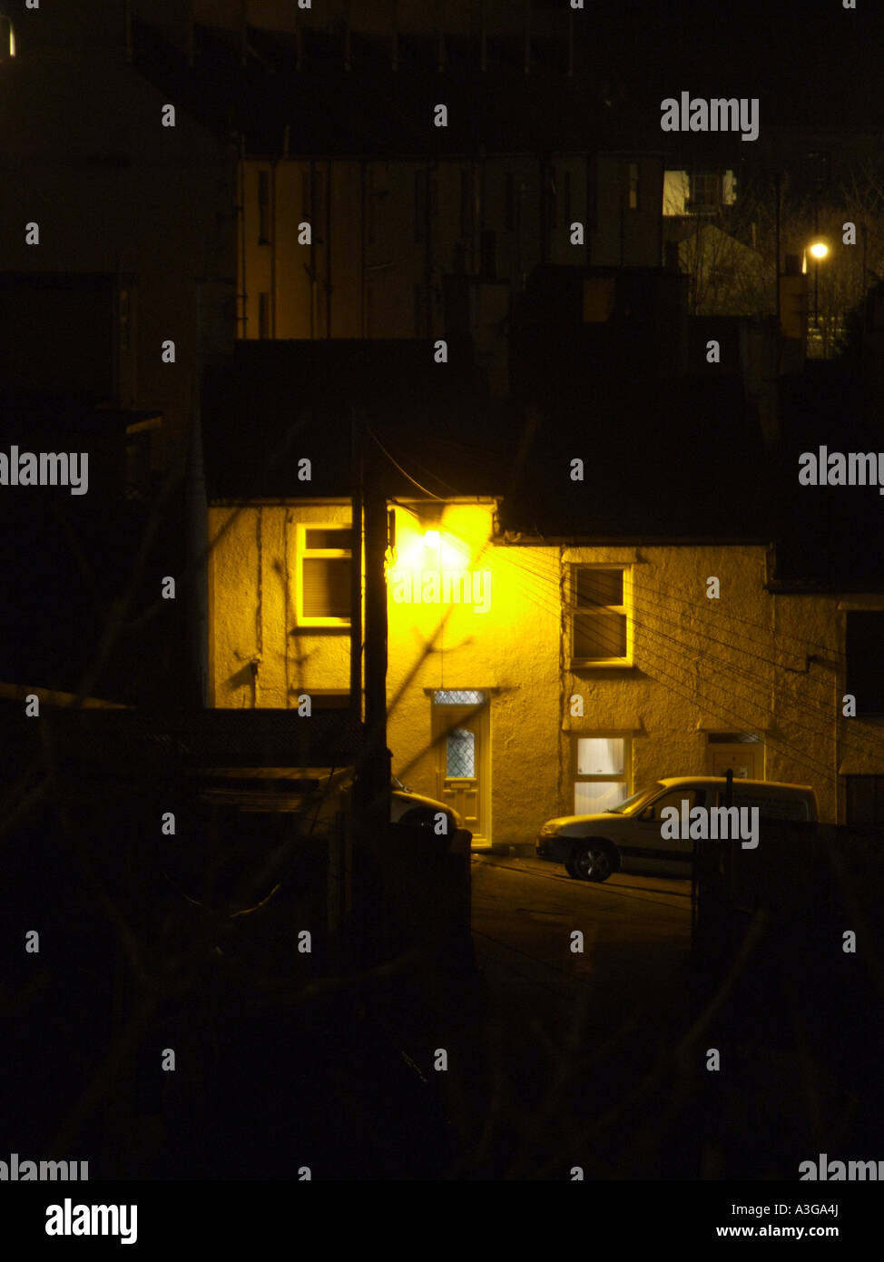 car parked outside house at night Stock Photo - Alamy