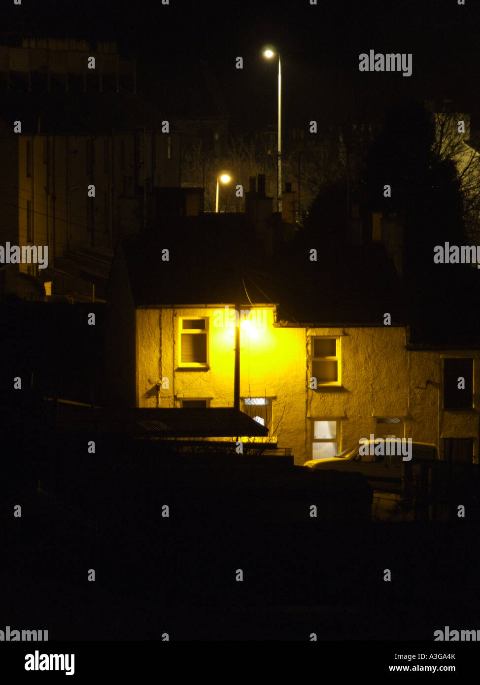 car parked outside house at night Stock Photo - Alamy