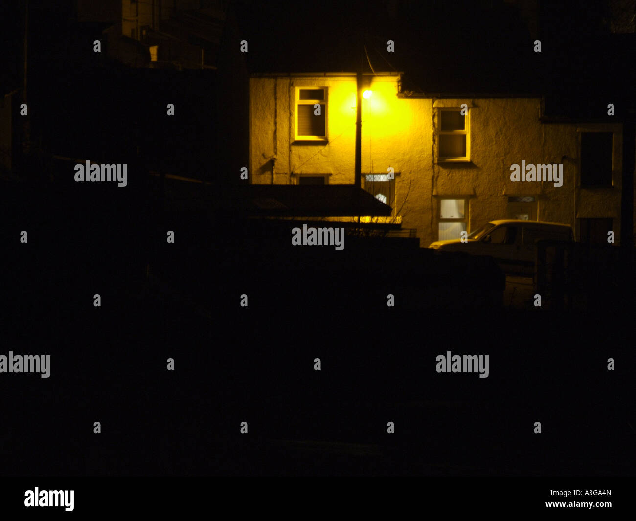 car parked outside house at night Stock Photo - Alamy