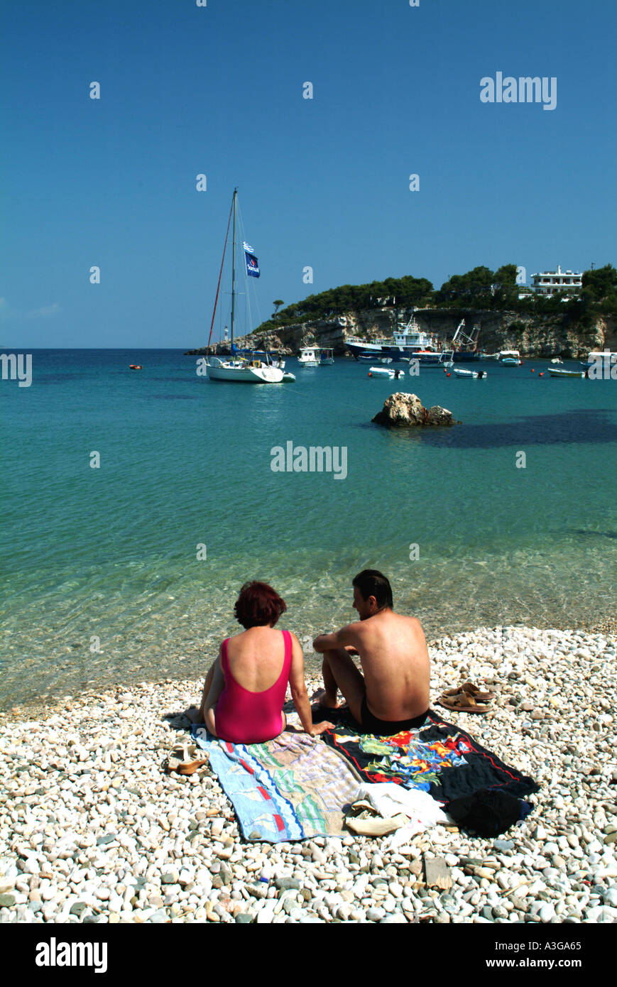 Couple on Patitiri beach Alonissos island Greece Stock Photo - Alamy