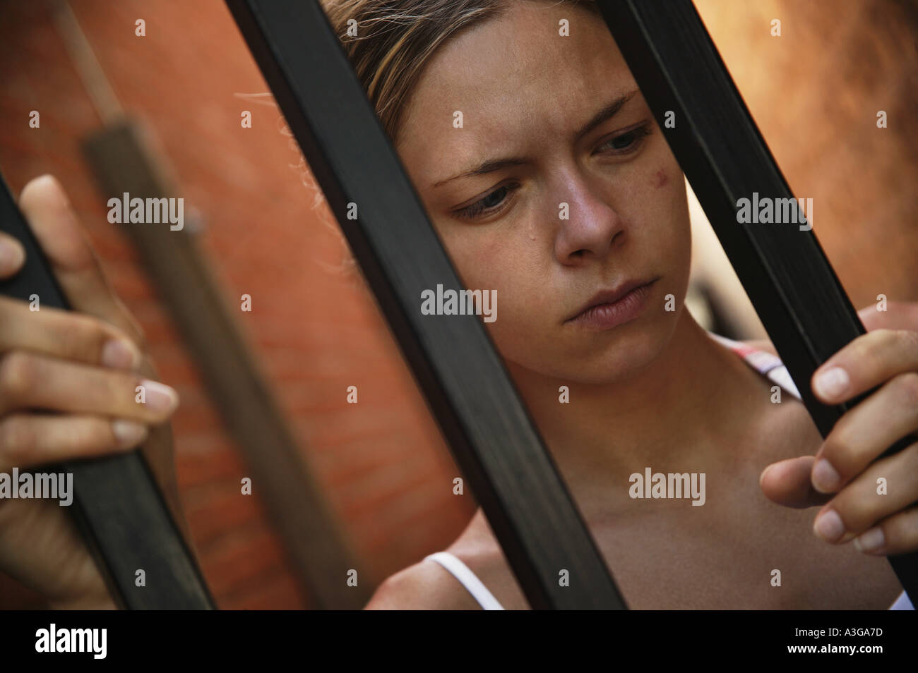 Woman behind bars hi-res stock photography and images - Alamy