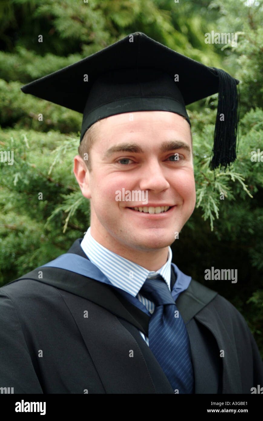 Freshly graduated young man Stock Photo - Alamy