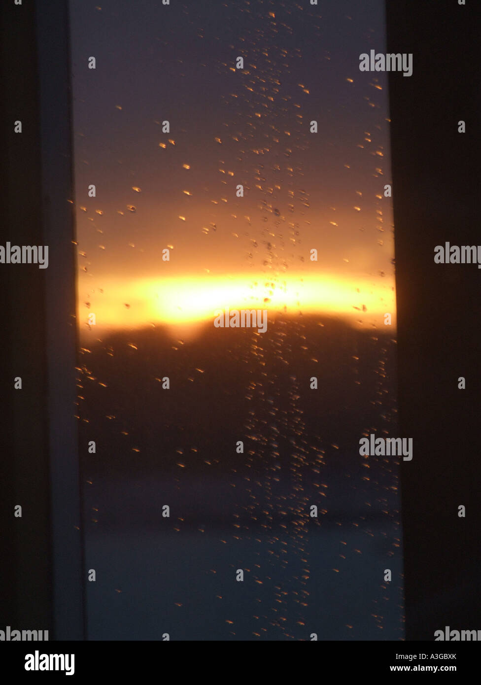 sunset seen through beach building window Stock Photo - Alamy
