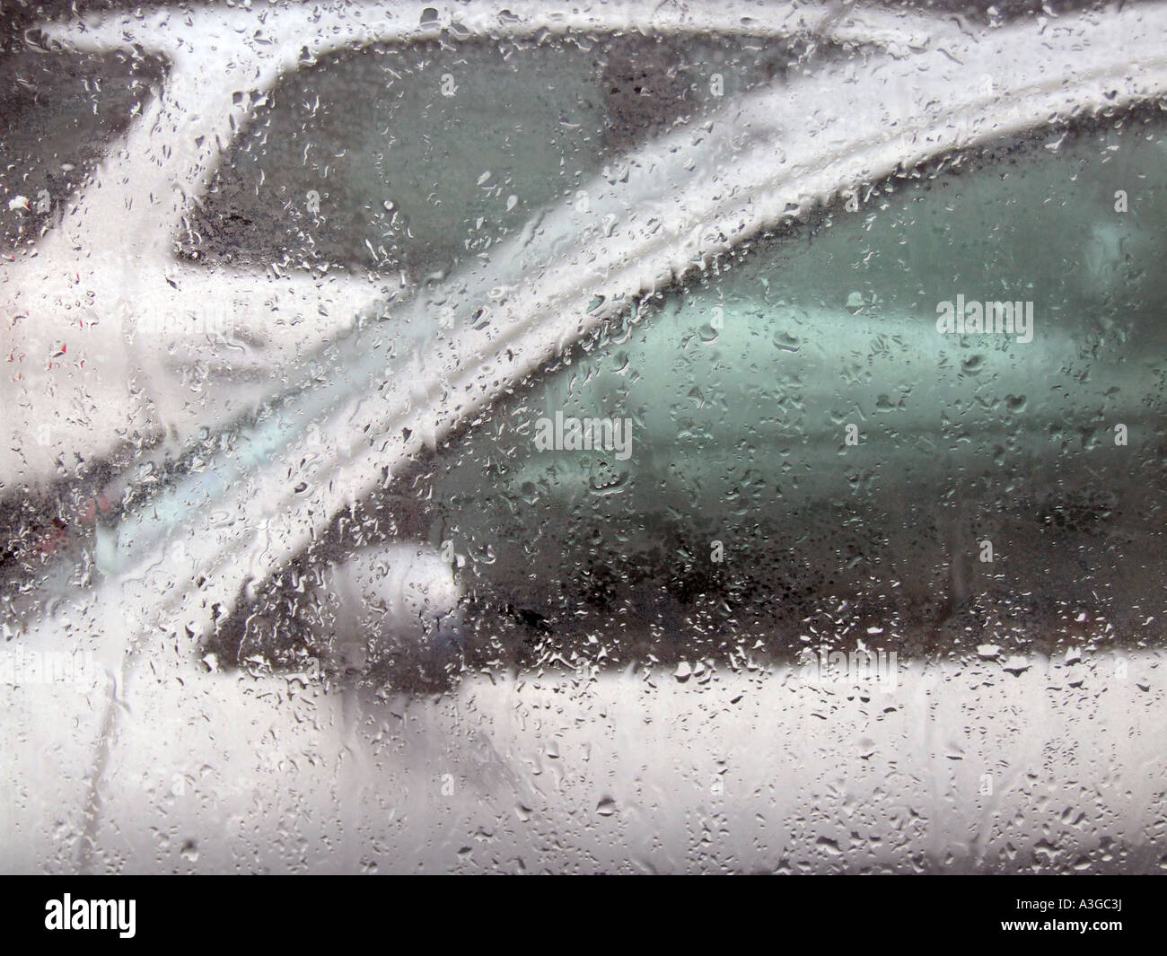 parked cars in rain Stock Photo - Alamy