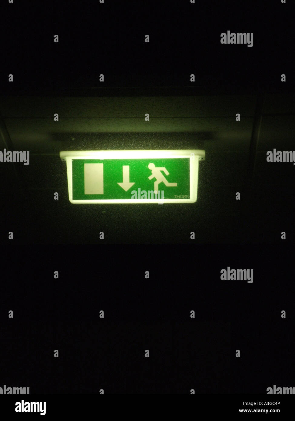 emergency exit sign in dark room Stock Photo - Alamy