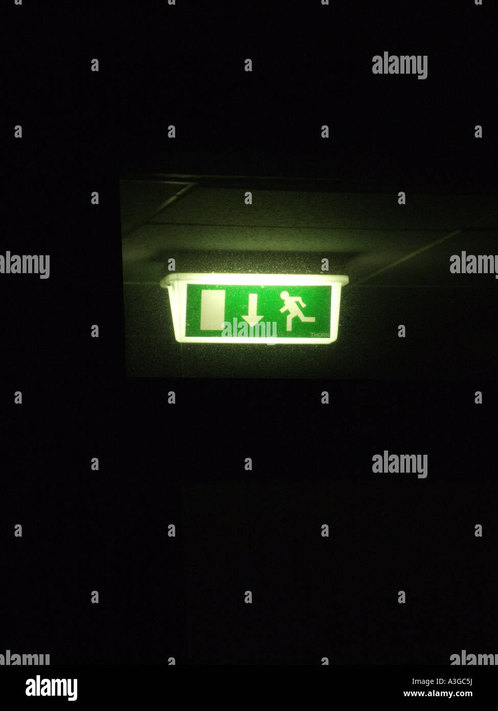emergency exit sign in dark room Stock Photo - Alamy