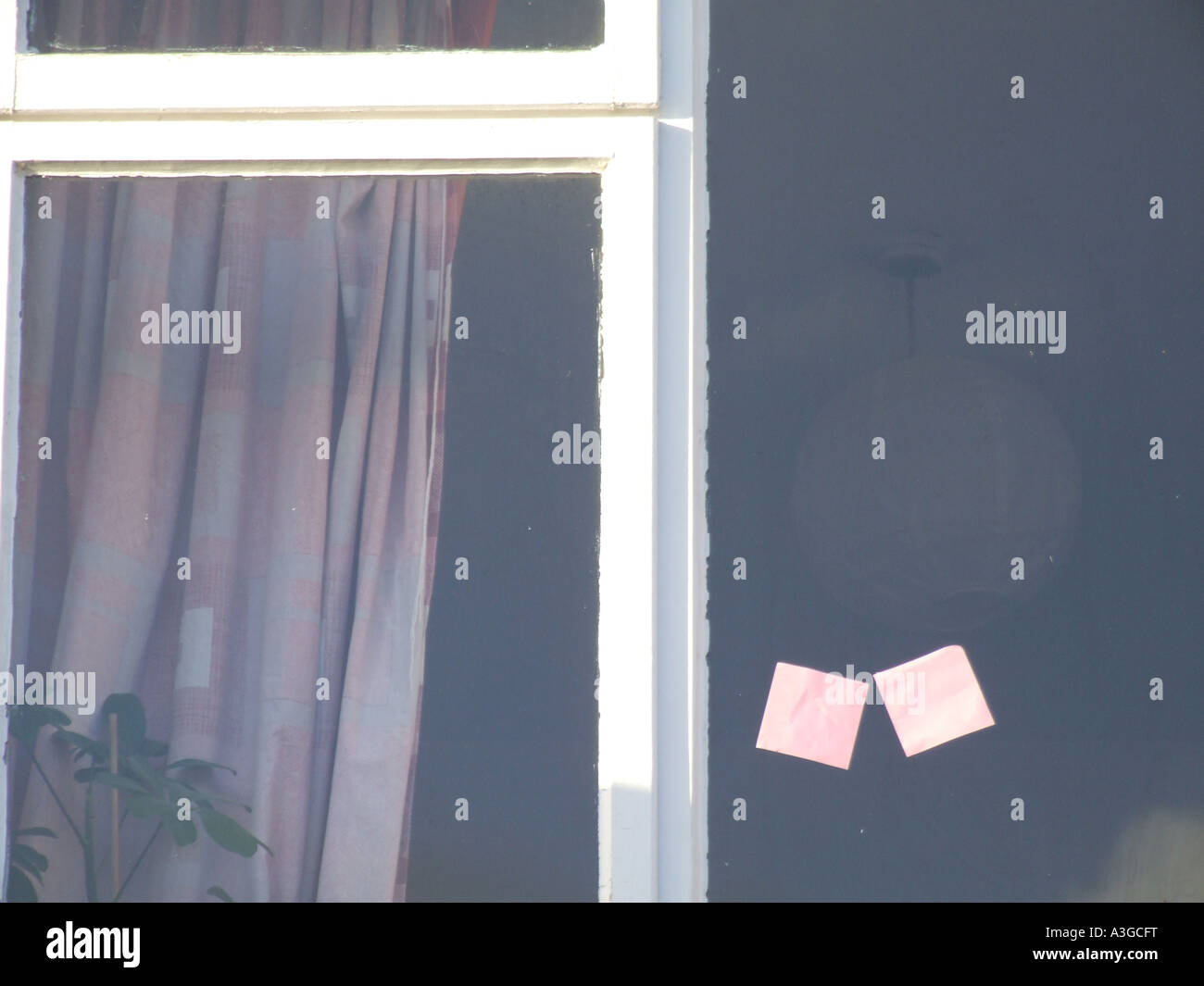 two sticky notes on window Stock Photo - Alamy