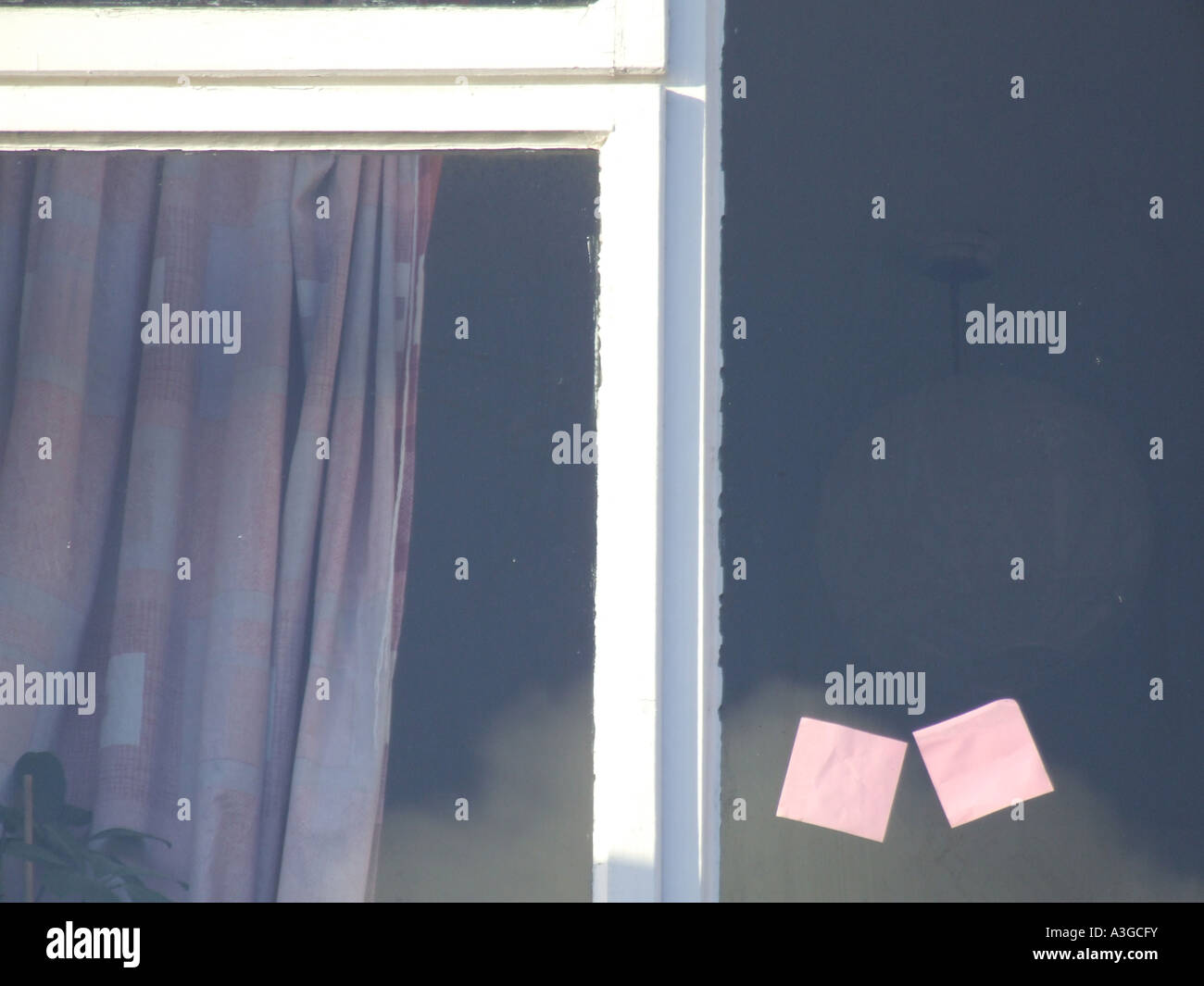two sticky notes on window Stock Photo - Alamy