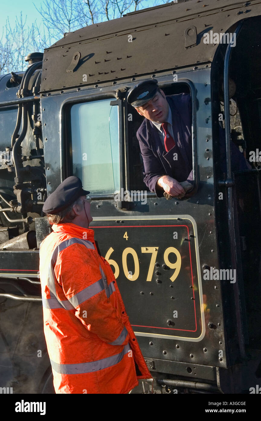 East Lancs Railway steam train driver and guard Stock Photo - Alamy