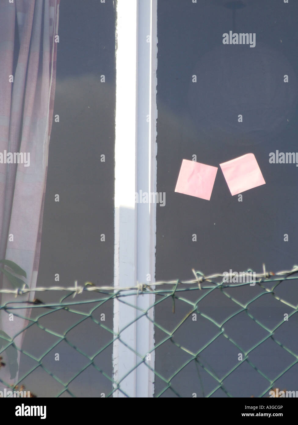 two sticky notes on window Stock Photo - Alamy
