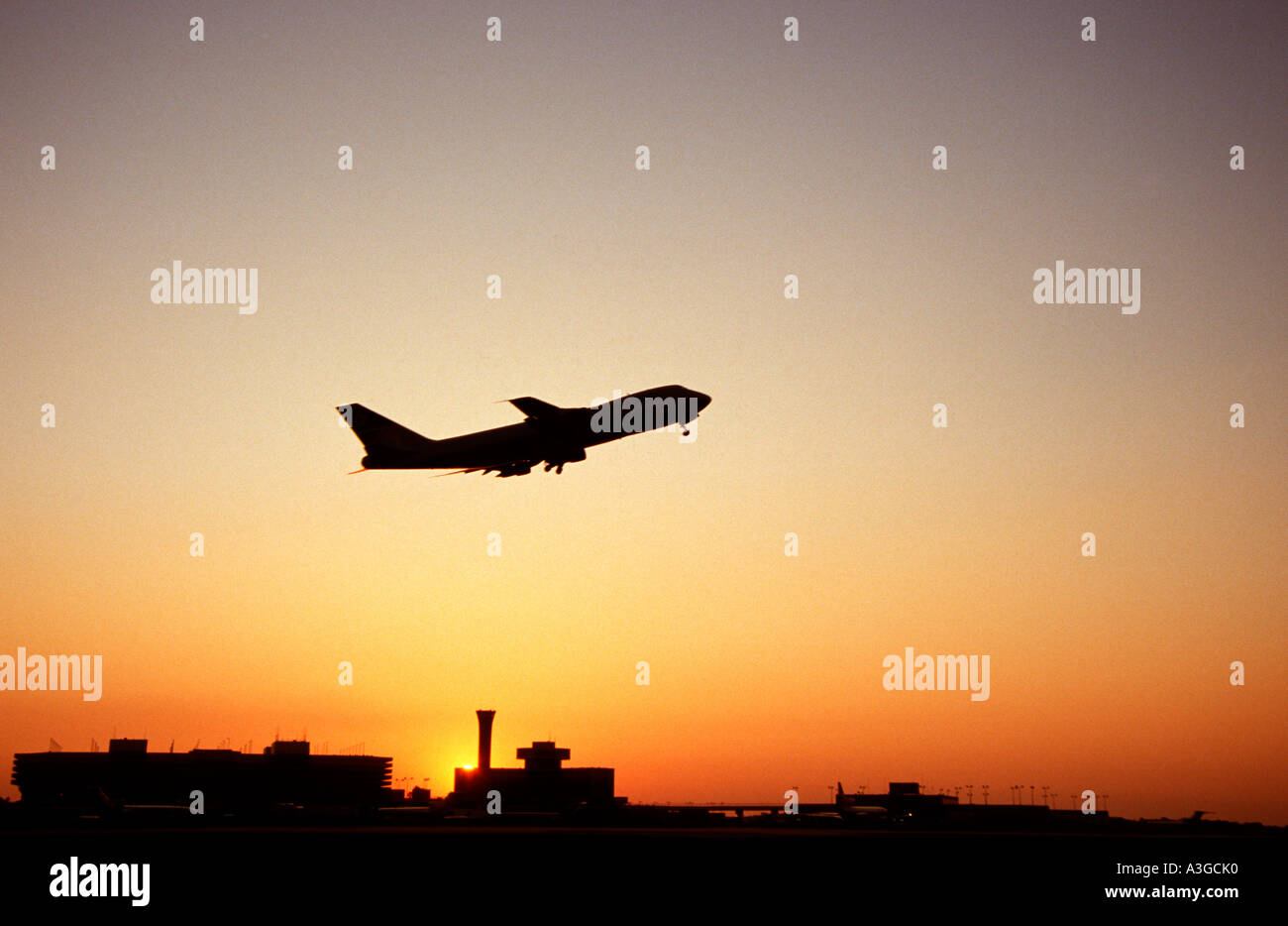 747 airplane taking off from Tampa International Airport at sunset ...