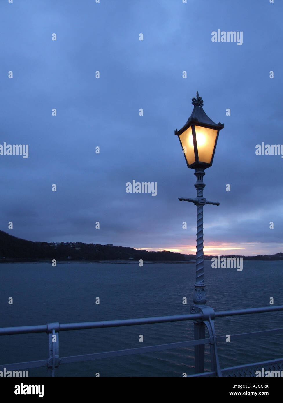one old damaged street lamp at night by sea Stock Photo - Alamy