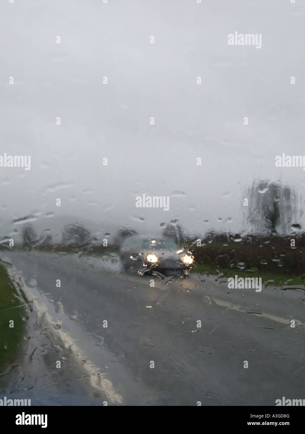 car driving in heavy rain in countryside Stock Photo - Alamy