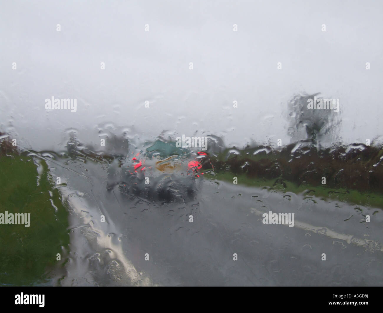 car driving in heavy rain in countryside Stock Photo - Alamy