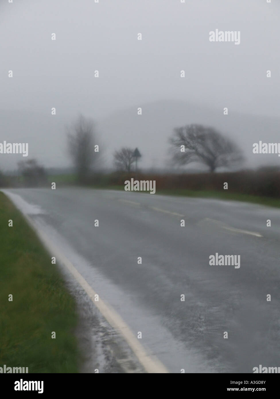rural street in rain in countryside Stock Photo - Alamy
