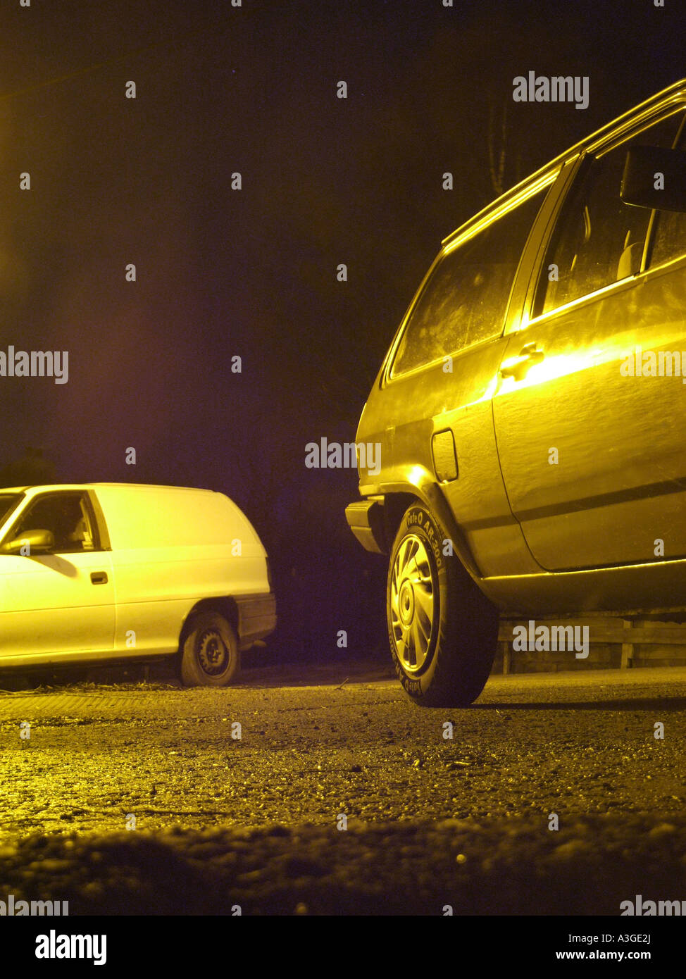 two cars parked at night Stock Photo - Alamy