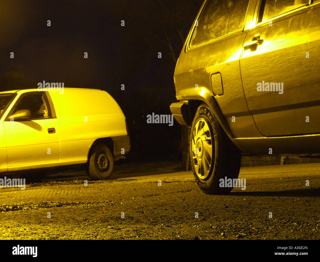 two cars parked at night Stock Photo - Alamy