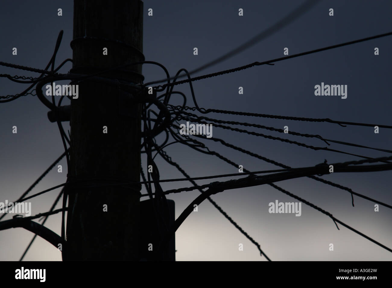 A telegraph pole against a moody backdrop Stock Photo - Alamy