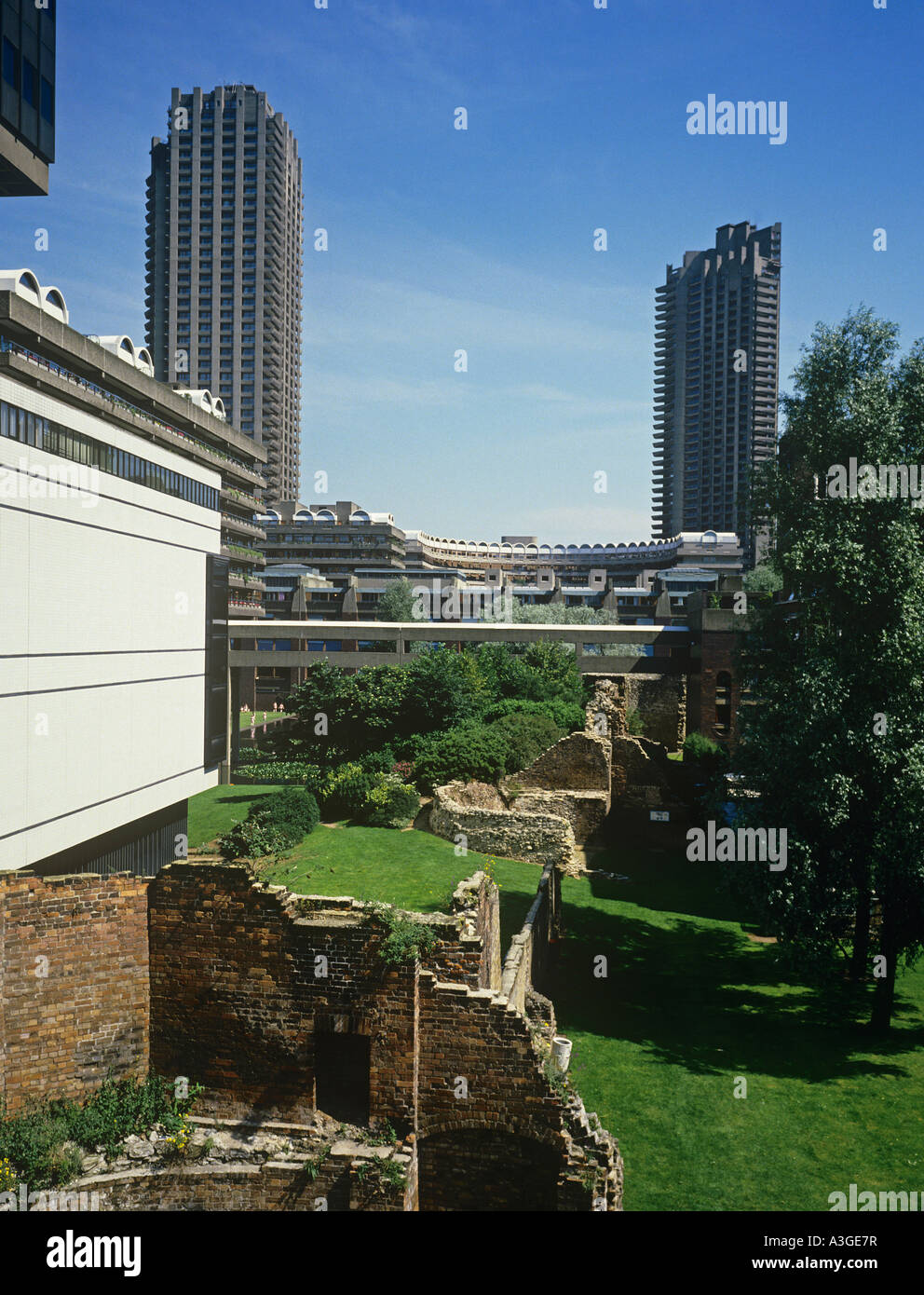 Remains of The Old Roman Wall with the modern towers of The Barbican in ...