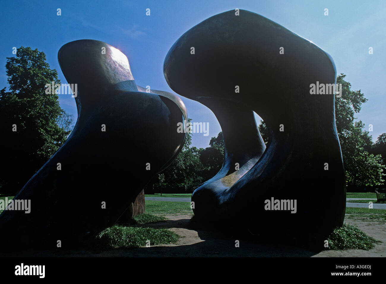 TWO LARGE FORMS one of several Henry Moore sculptures forming an open ...