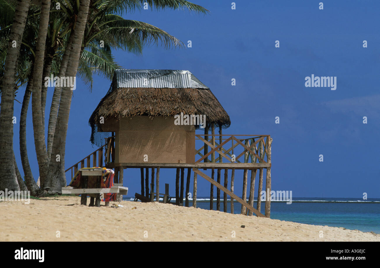 A thatched bungalow or beach fale on stilts at Jane s Beach Fales ...