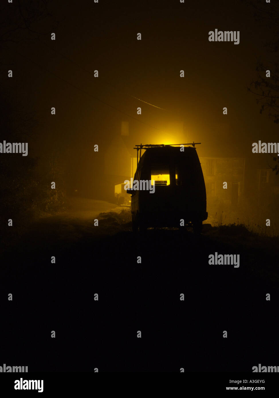 one small van on fog covered country lane at night Stock Photo - Alamy