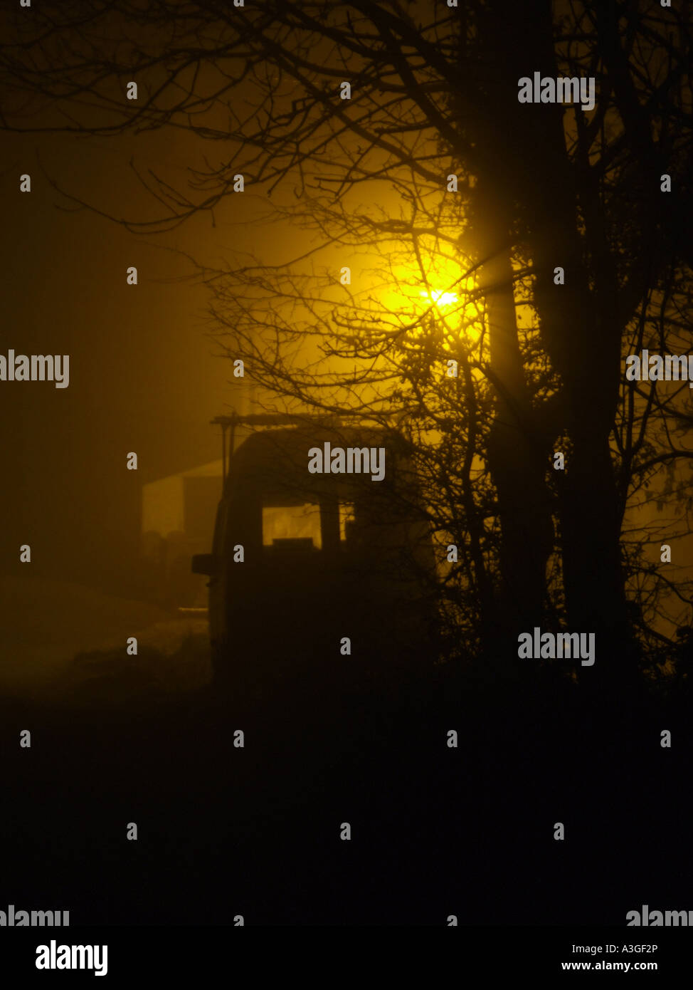 one mini van on country lane in fog at night Stock Photo - Alamy