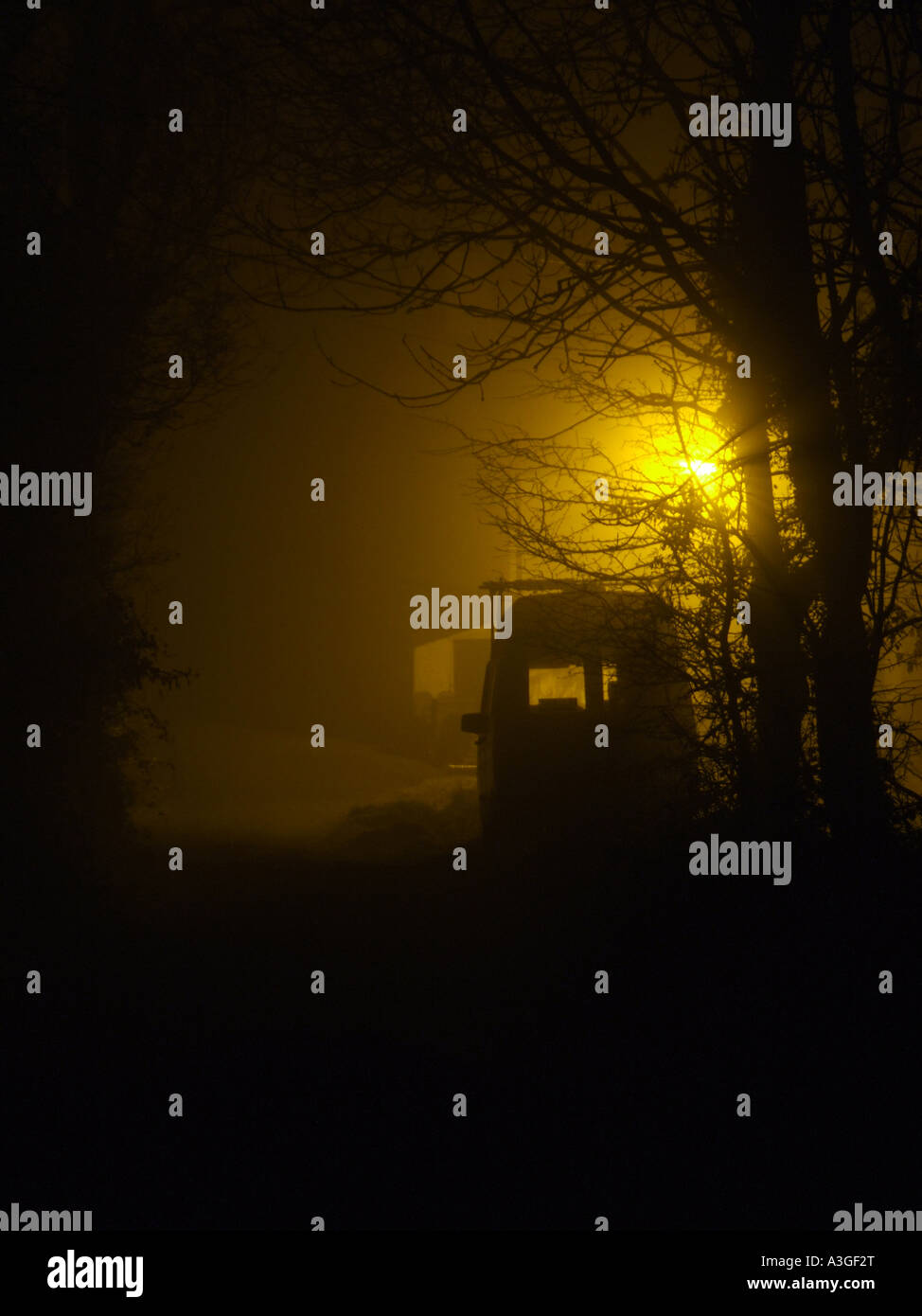 one mini van on country lane in fog at night Stock Photo - Alamy