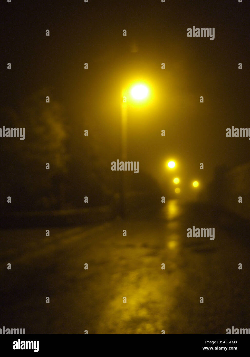 empty street covered with fog at night Stock Photo - Alamy