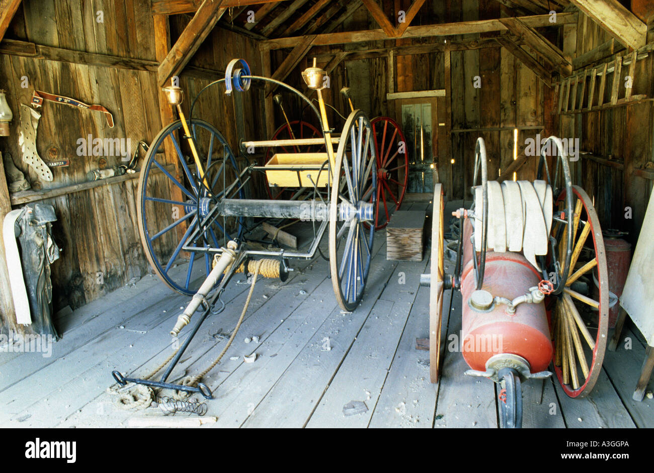 Interior of fire station with fire engines in the ghost town of Bodie ...