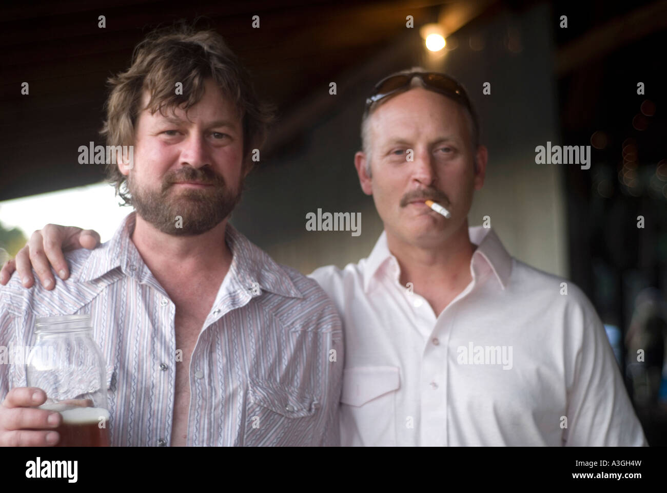Men at party with beer and cigarettes Stock Photo - Alamy
