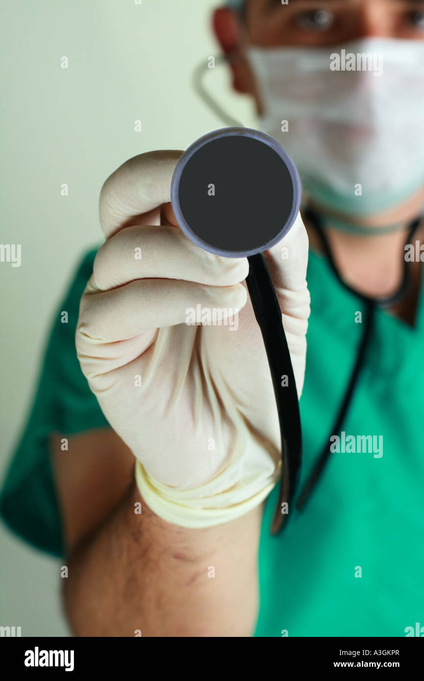 Doctor with stethoscope in an emergency or surgical room lighting ...