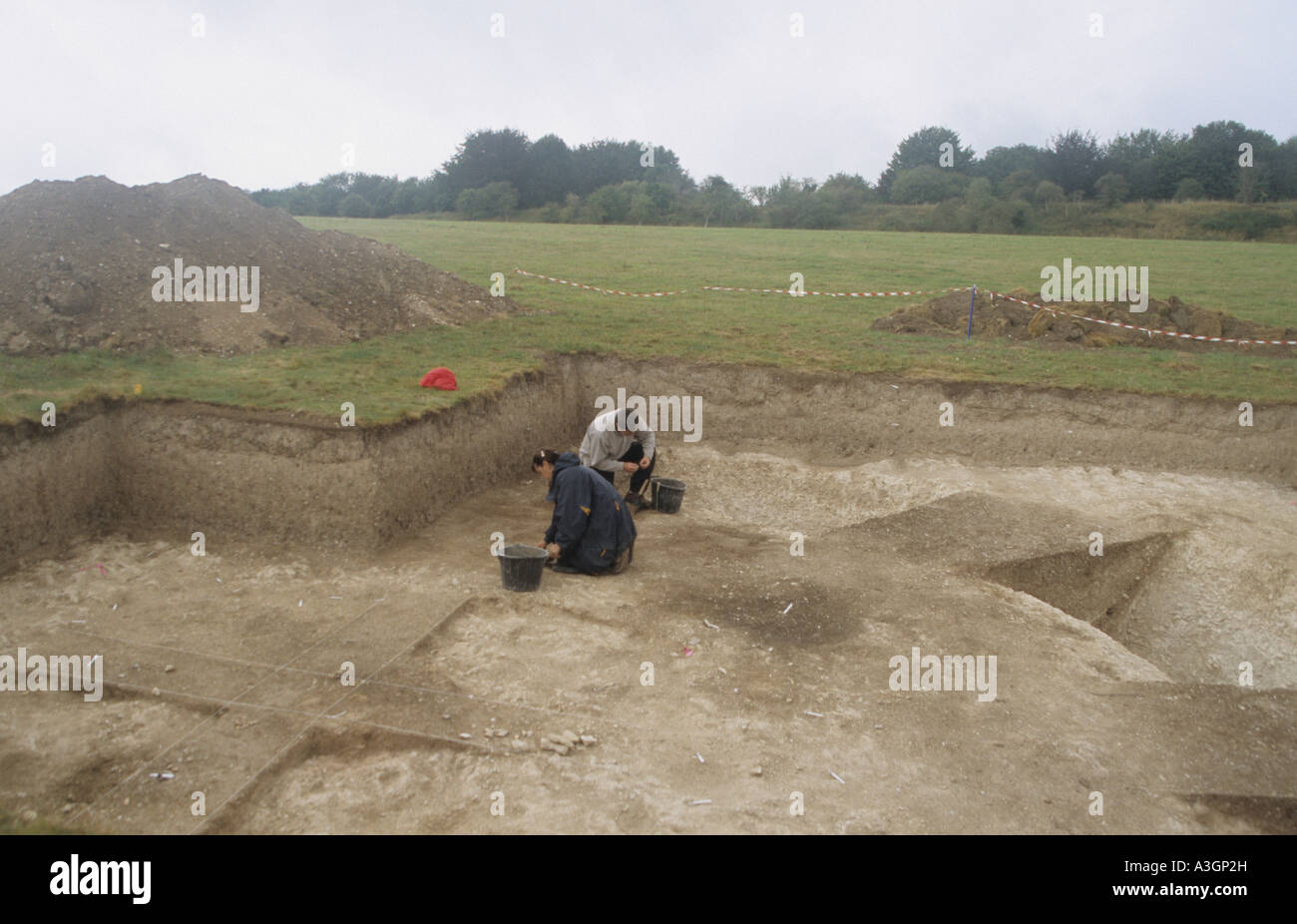 Archaeologists digging on an ancient site near Stonehenge in England ...