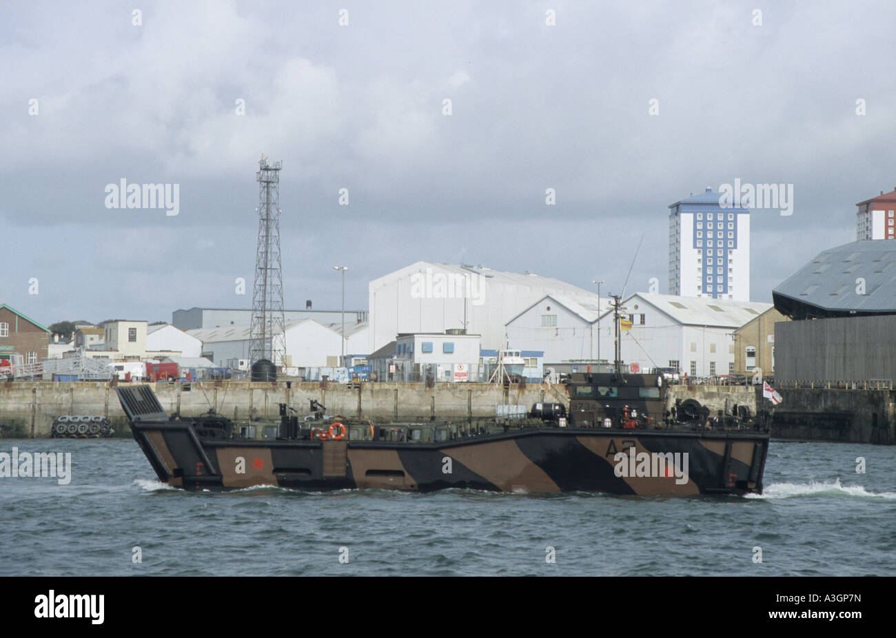 Royal Marines landing craft sailing past Devonport Dockyard Plymouth UK ...