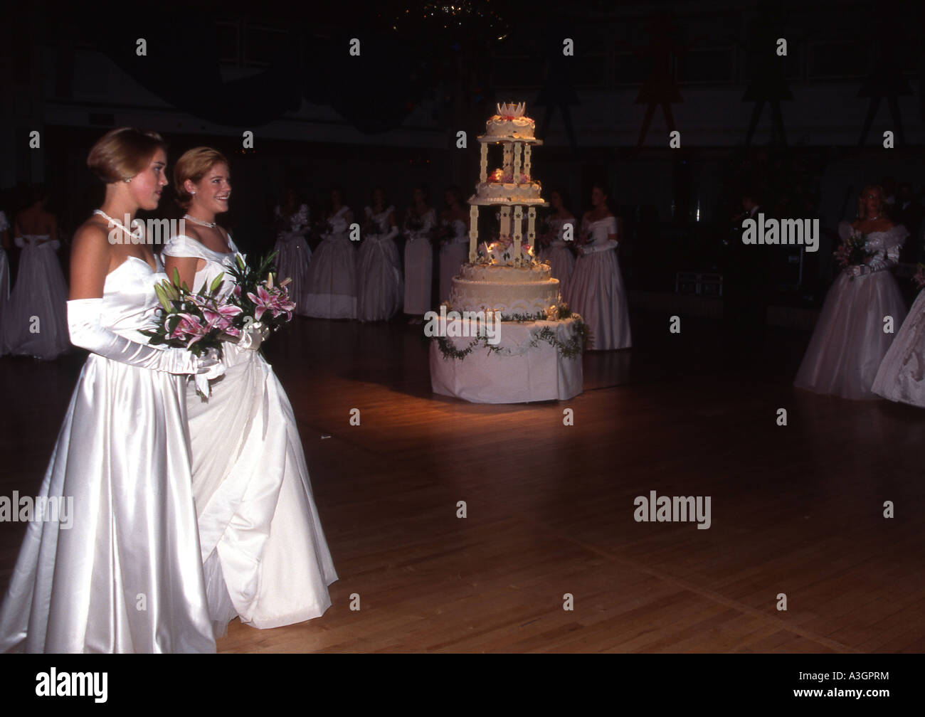 Debutantes passing the cake Queen Charlotte s Birthday Ball Stock Photo ...