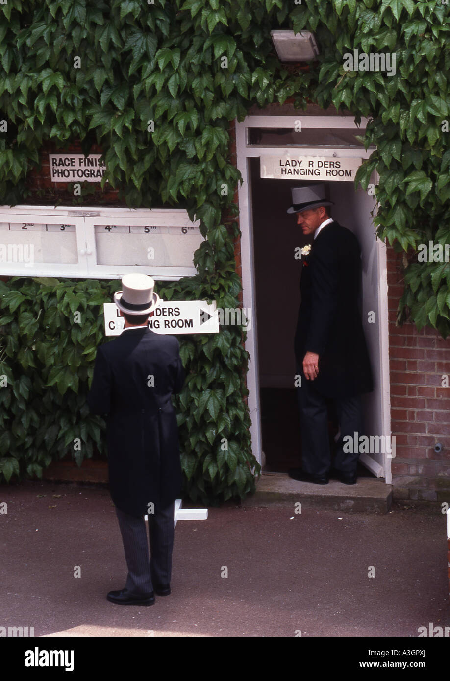 Morning suited man entering Lady Riders Changing Room Ascot Racecourse ...