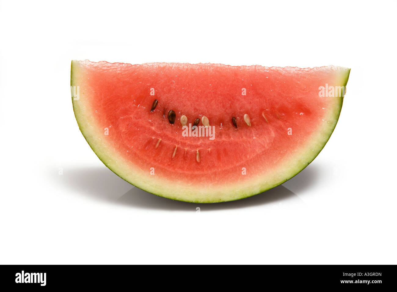 Watermelon slice isolated on a white studio background Stock Photo - Alamy